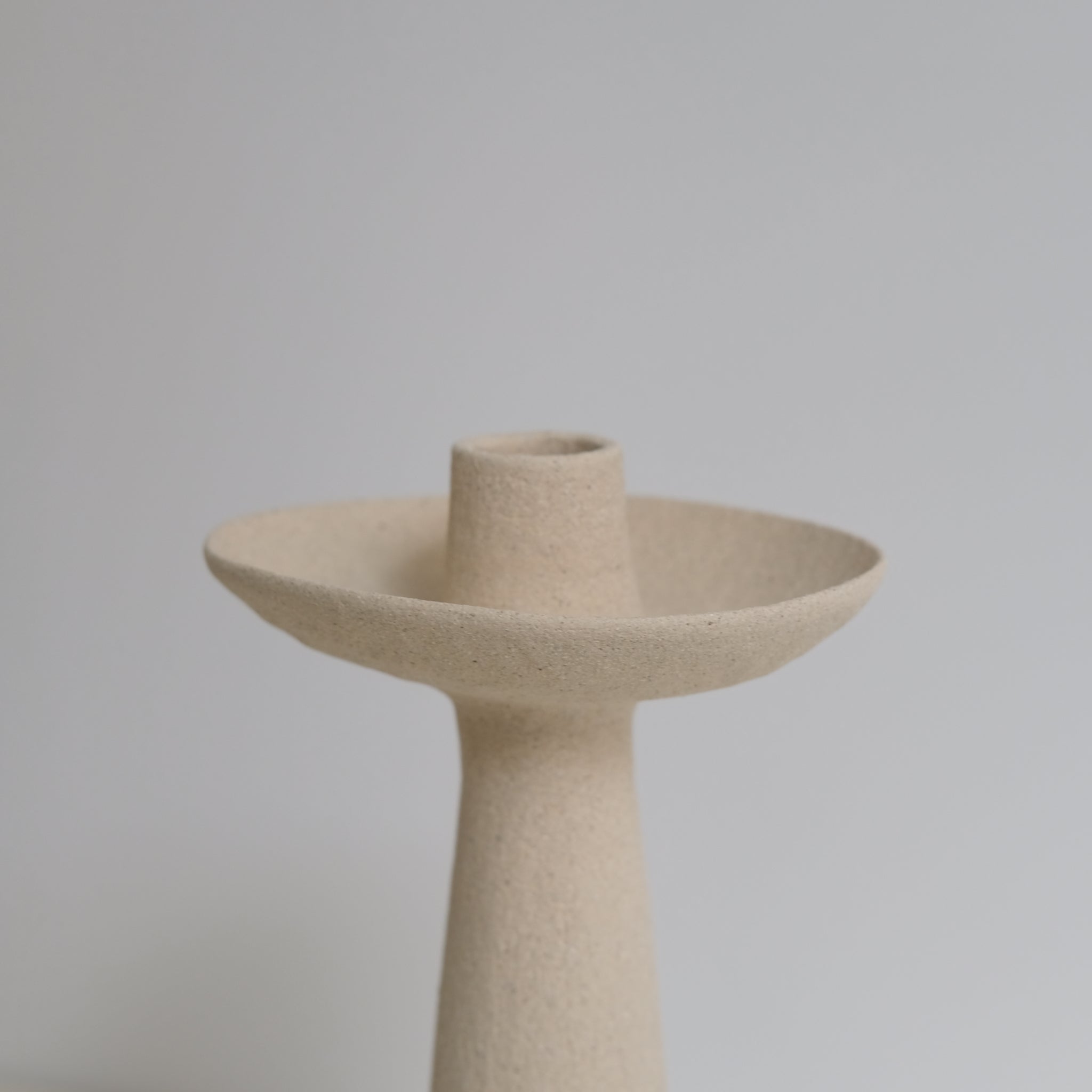 Candlestick in beige sandstone H 25cm by Sophie Vaidie at Brutal Ceramics